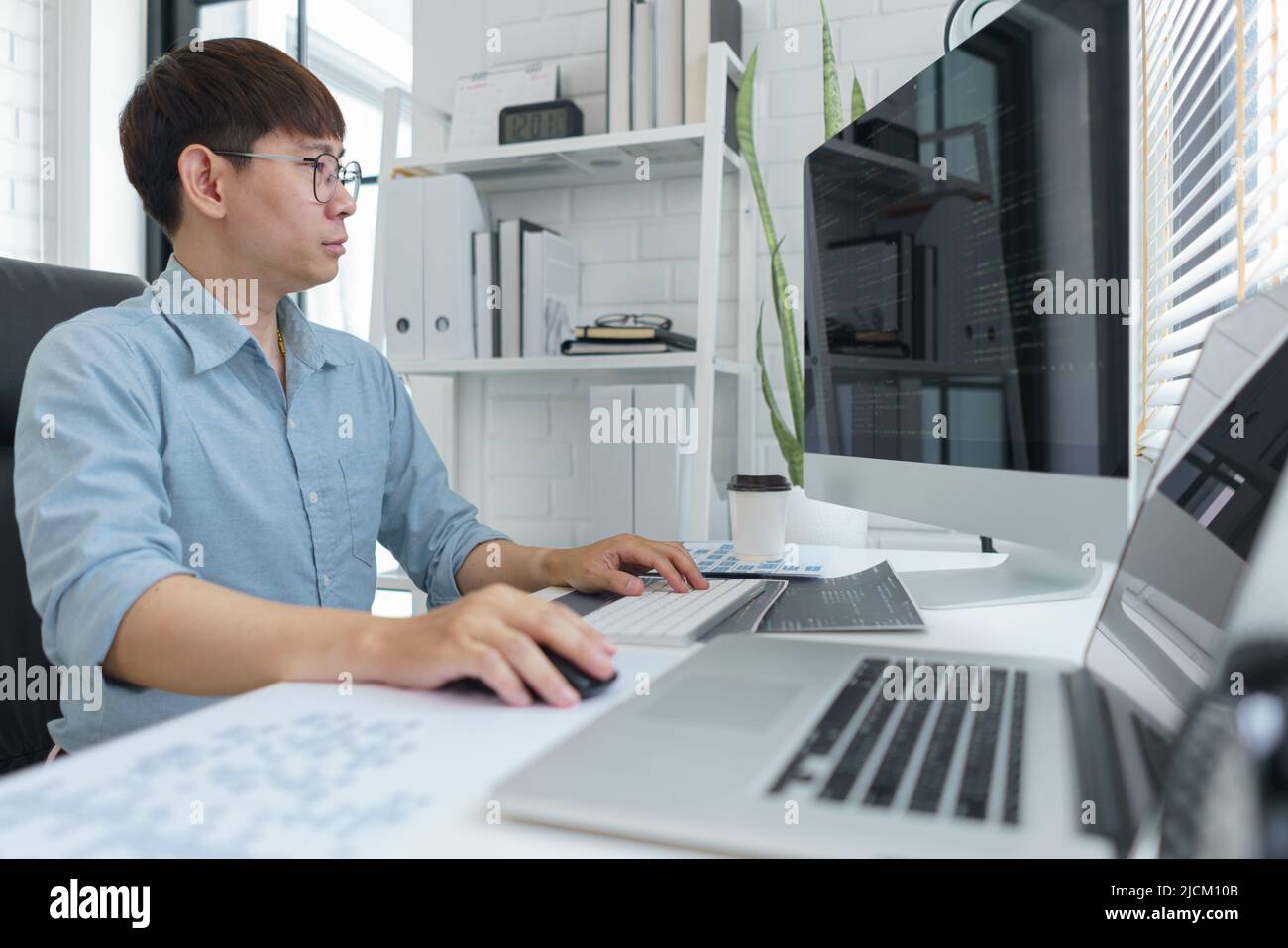 Software development concept, Male programmer typing data code on ... Software development concept, Male programmer typing data code on ...