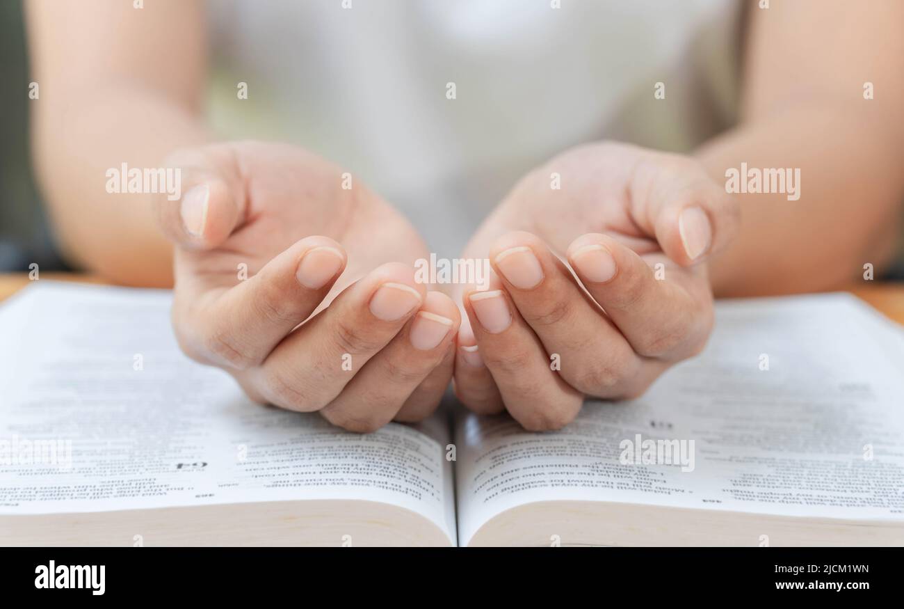 Pray and religion concept, Female christian reading bible and praying ...