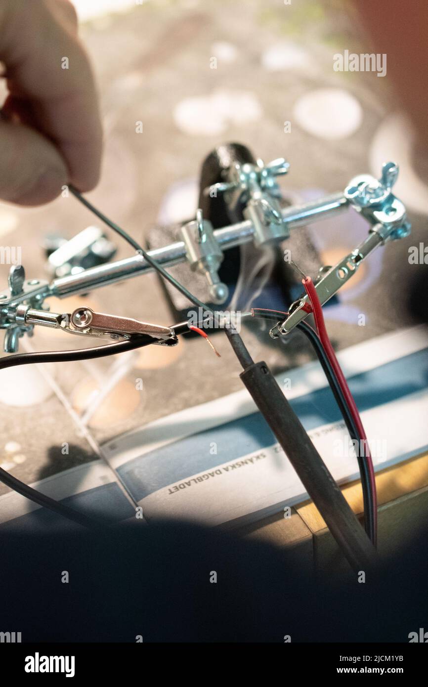 Closeup of macro of a man doing electricity work or putting wires ...
