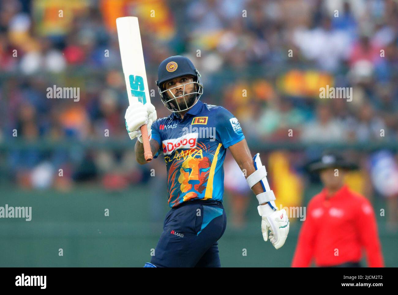 Kandy, Sri Lanka. 14th June 2022. Kusal Mendis of Sri Lanka raises his ...