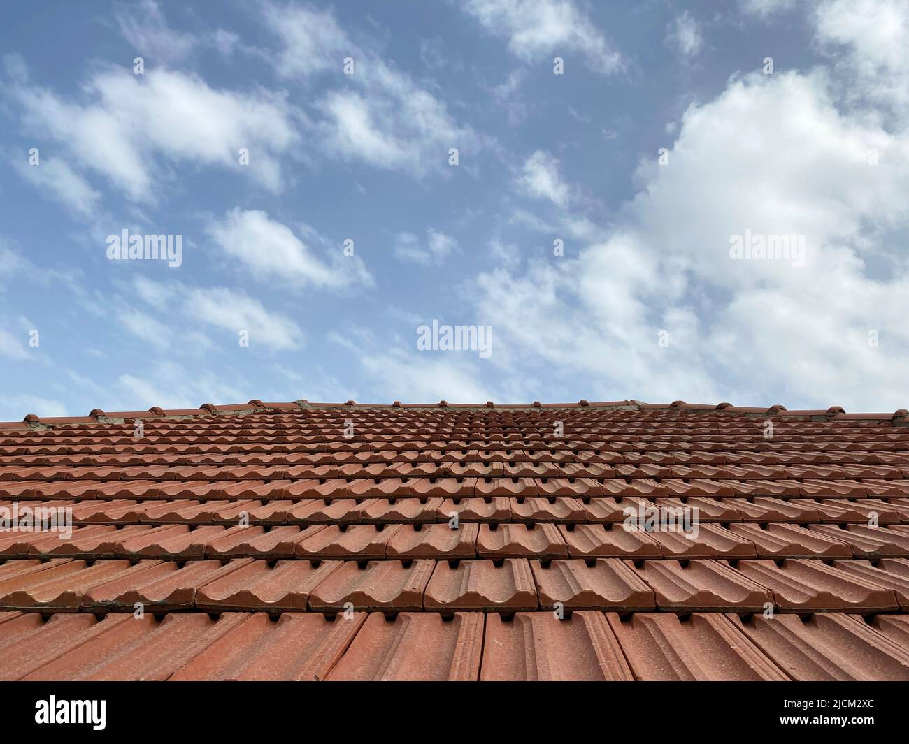 tile roof and sky. view of the roof from below. copy space for text ...