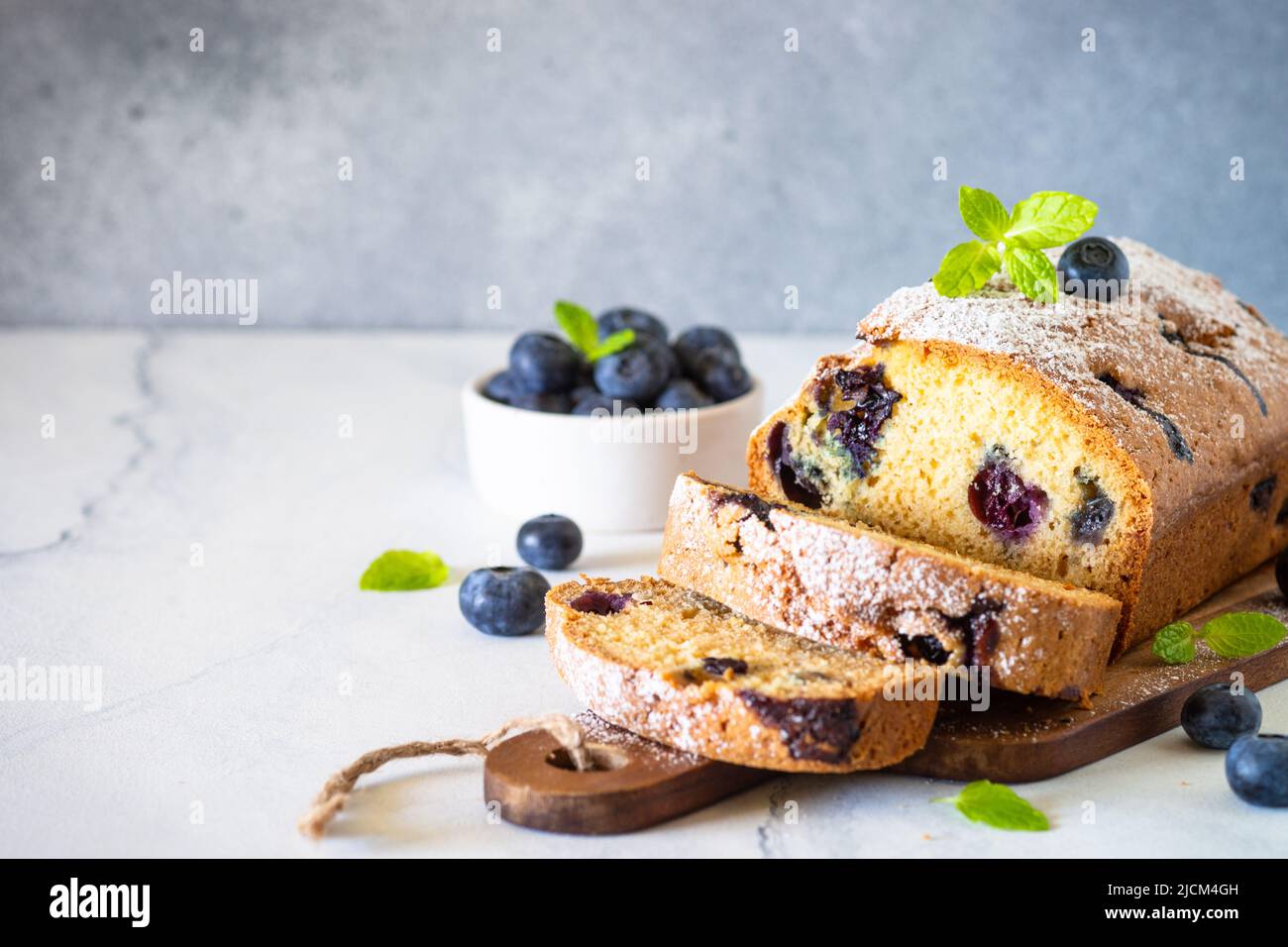 Blueberry cake on white background Stock Photo - Alamy