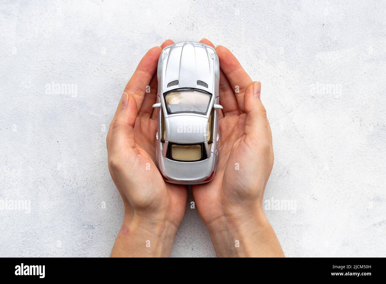 Driving toy car hands hi-res stock photography and images - Alamy