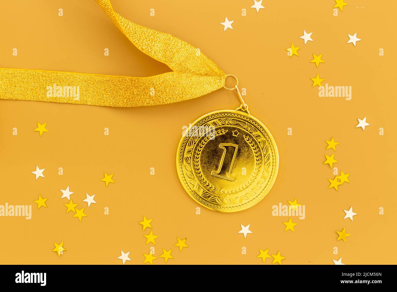 Gold medal first place on ribbon with stars. Winner concept Stock Photo ...