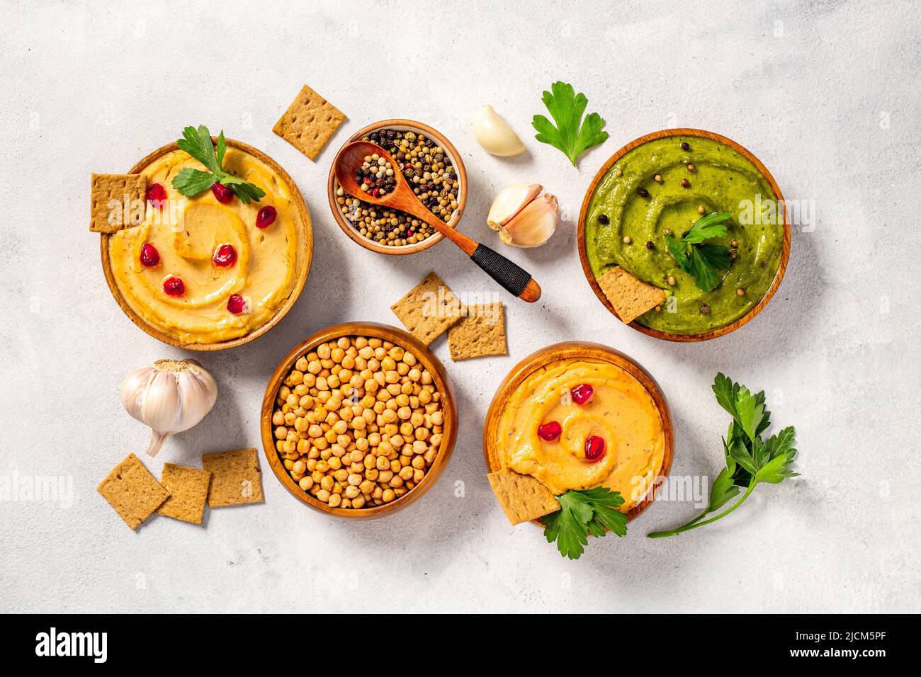 Hummus with snacks set - various types of hummus in bowls Stock Photo ...