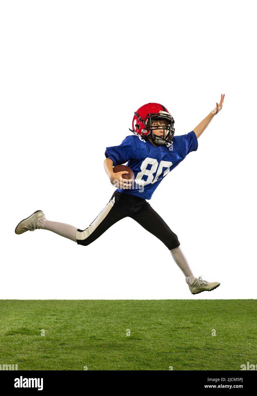 Athletic kid, beginner american football player in sports uniform and ...