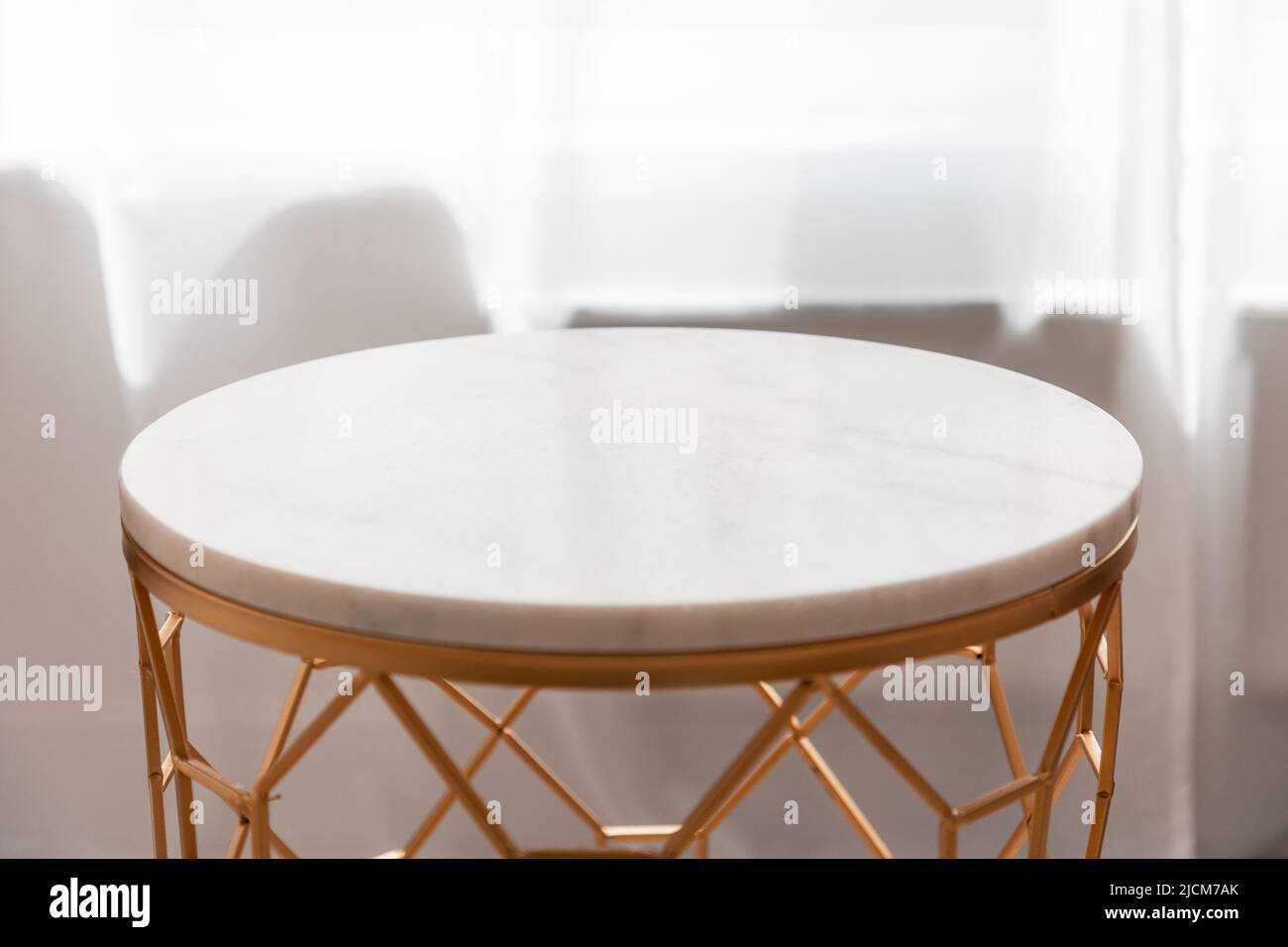 An empty marble table with gold fittings. Copy space. Luxury style ...