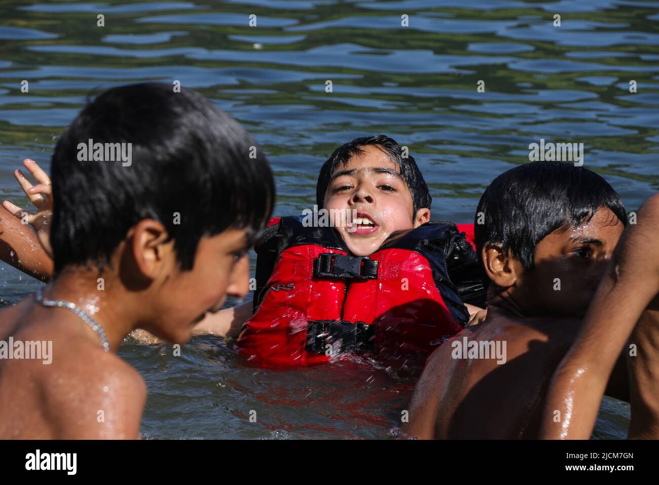 June 14, 2022, Srinagar, Jammu and Kashmir, India: Kids bath on the ...