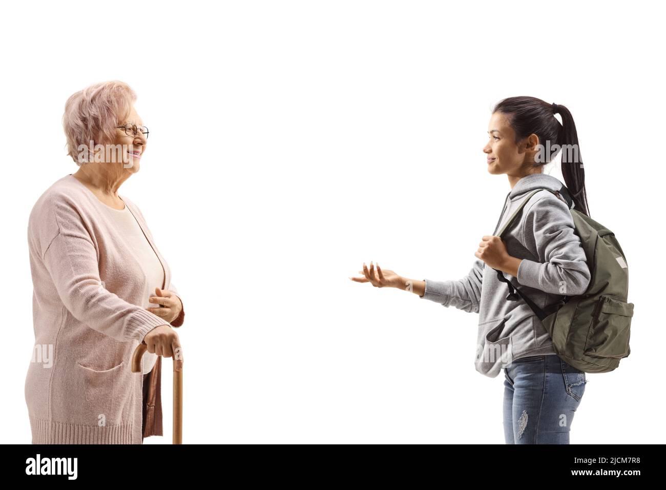 Student talking to a senior woman with a walking cane isolated on white ...