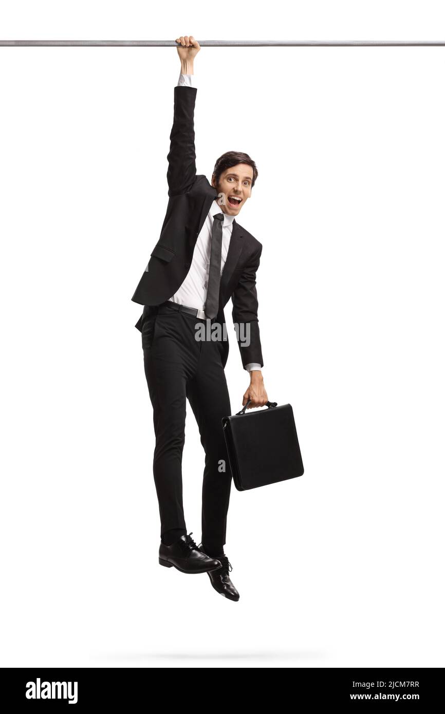 Businessman hanging and holding onto a bar isolated on white background ...