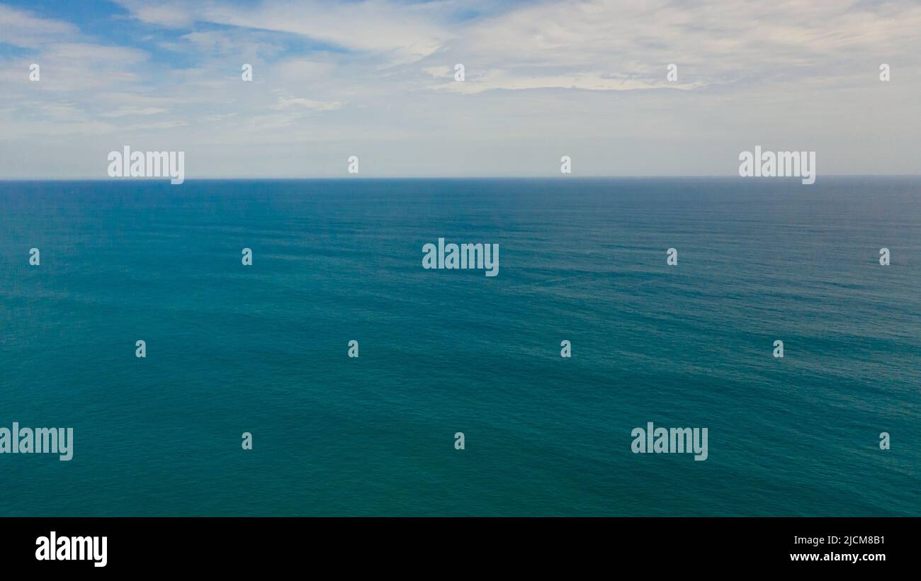 Open blue ocean with waves against the sky and clouds, top view Stock ...