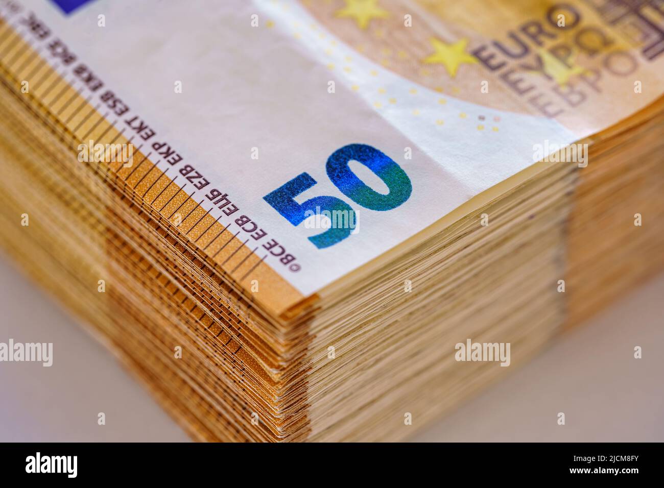 Large stack of 50 euro banknotes, European Union currency, on white ...