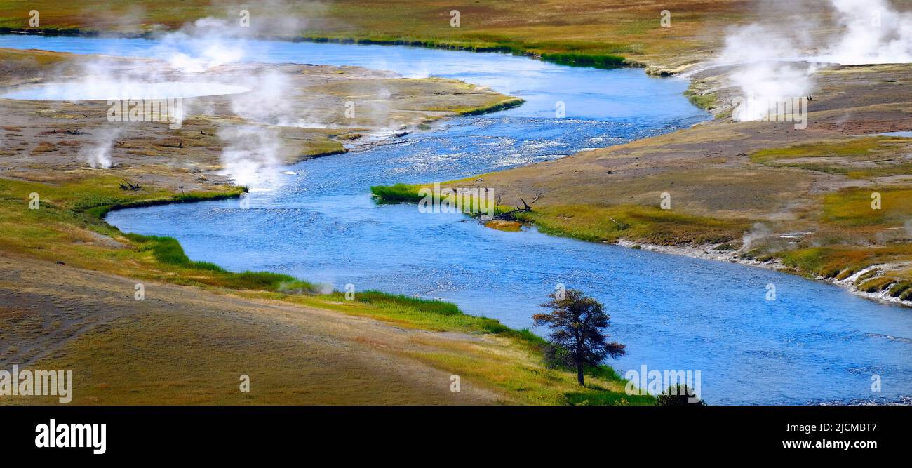 River flowing in wilderness with steam rising in hot springs Stock ...