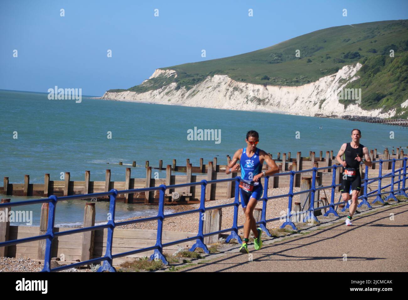 runner checking GPS watch on a run Stock Photo - Alamy