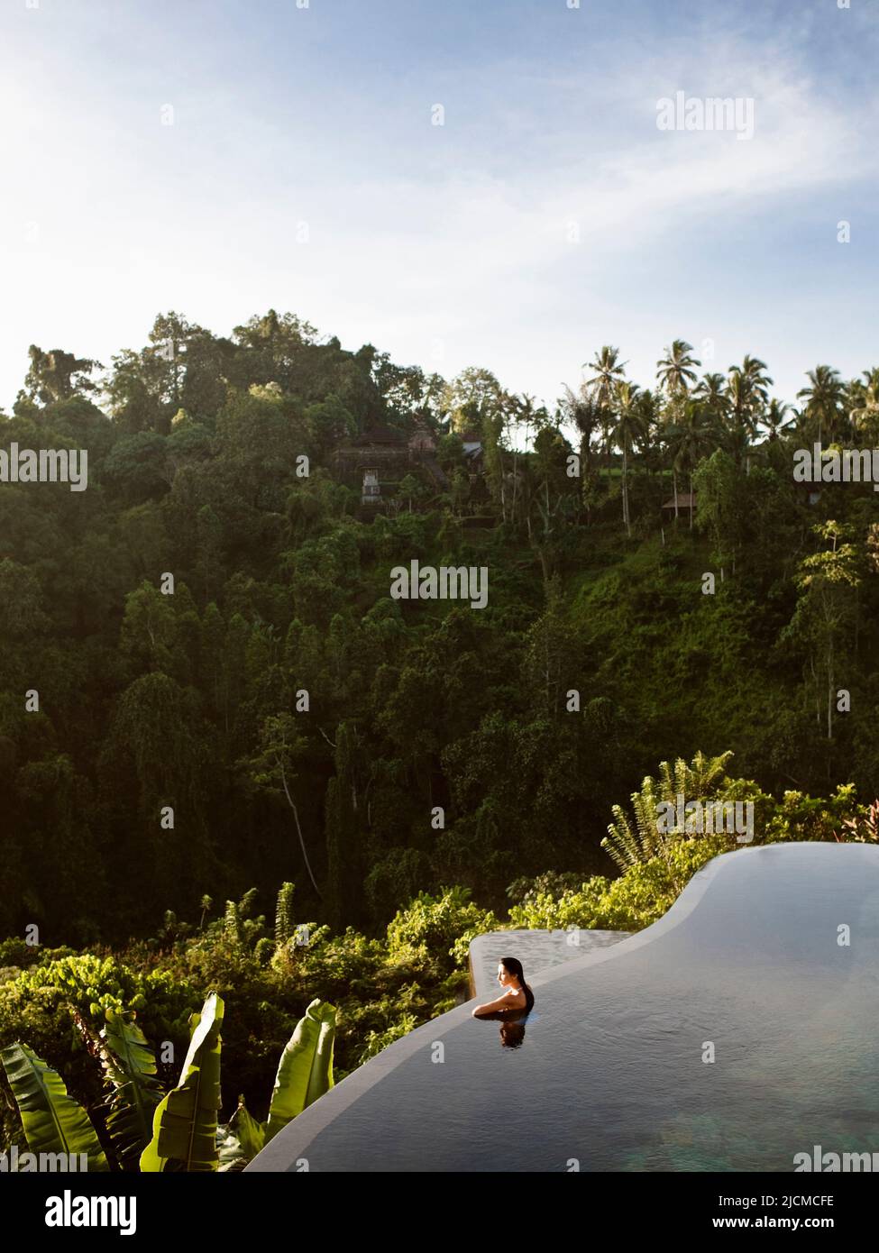 Female guest in two-tier infinity pool at Ubud Hanging Gardens, Bali ...