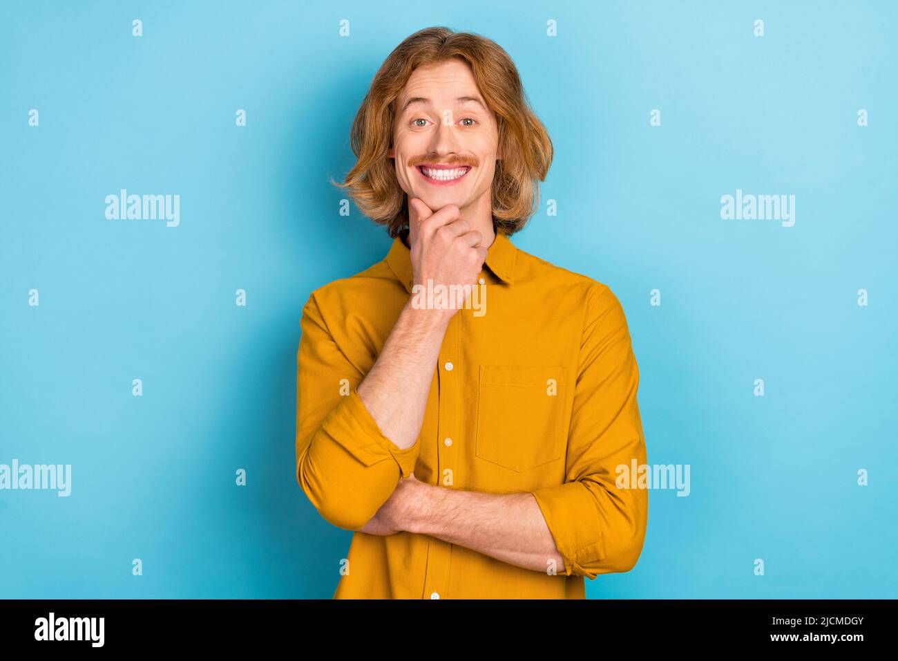 Portrait of attractive confident cheerful long-haired guy making ...