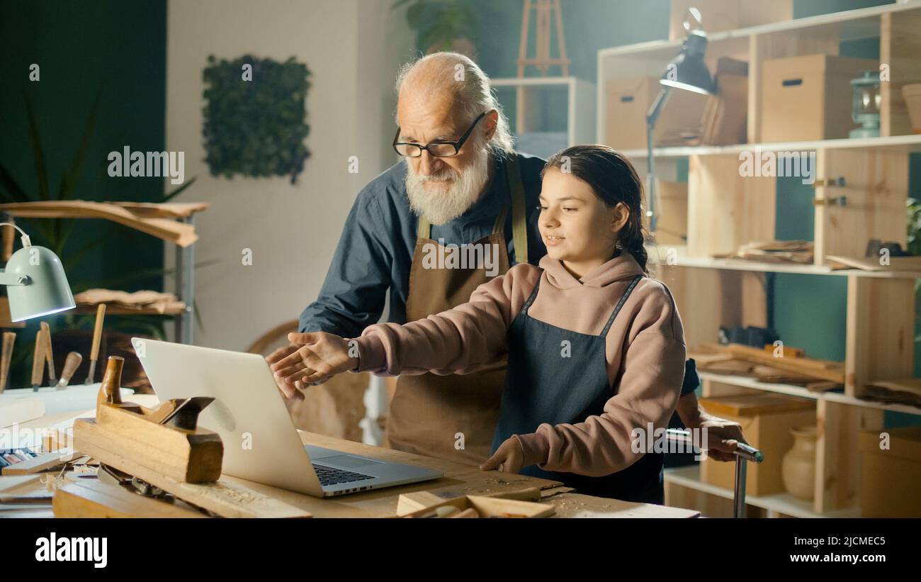 Grandfather Carpenter with his Teenage Granddaughter Develop Wood ...