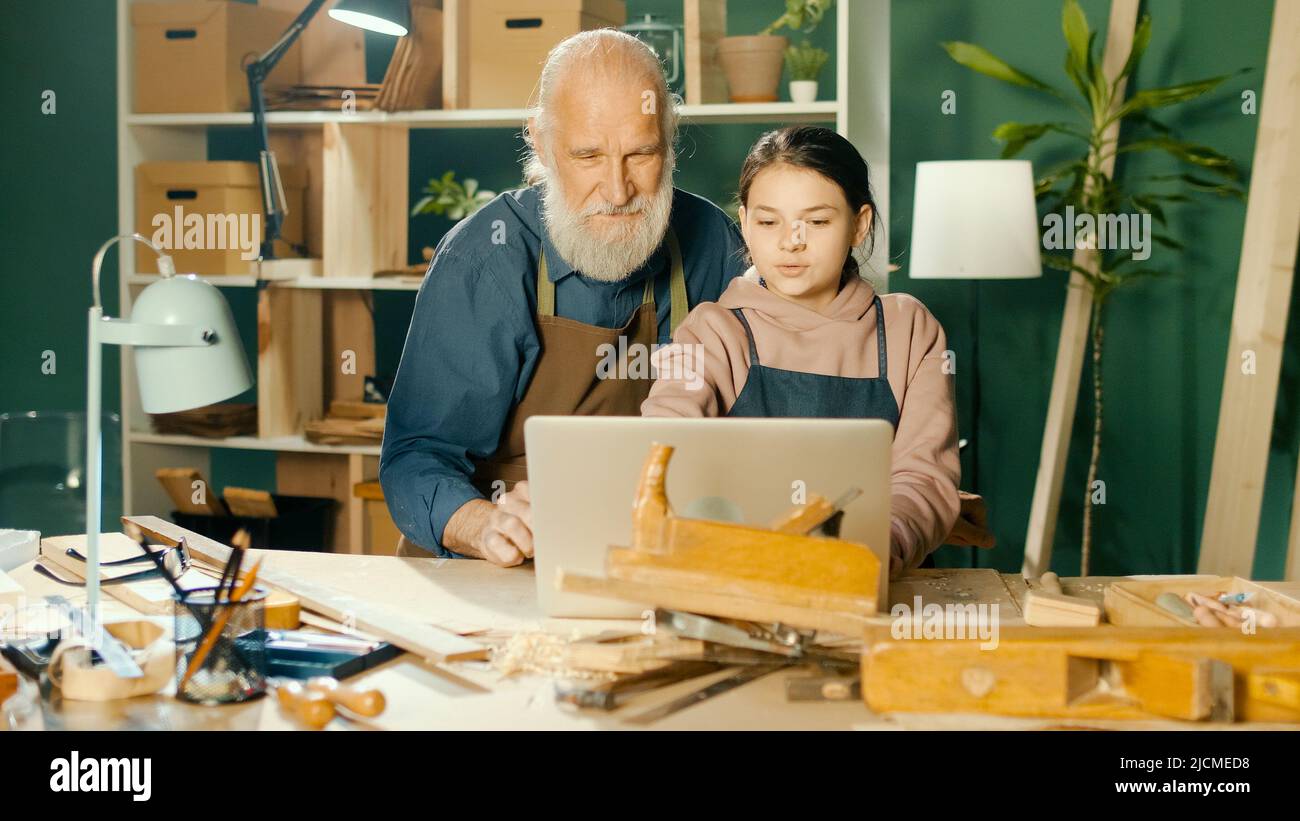 Grandfather Carpenter with his Teenage Granddaughter Develop Wood ...