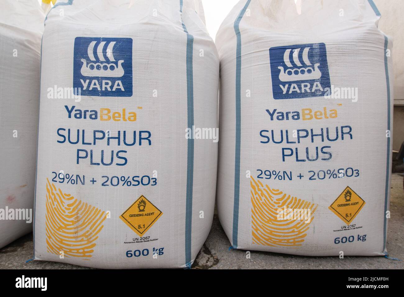 Sulphur plus artificial fertiliser in sacks Stock Photo - Alamy