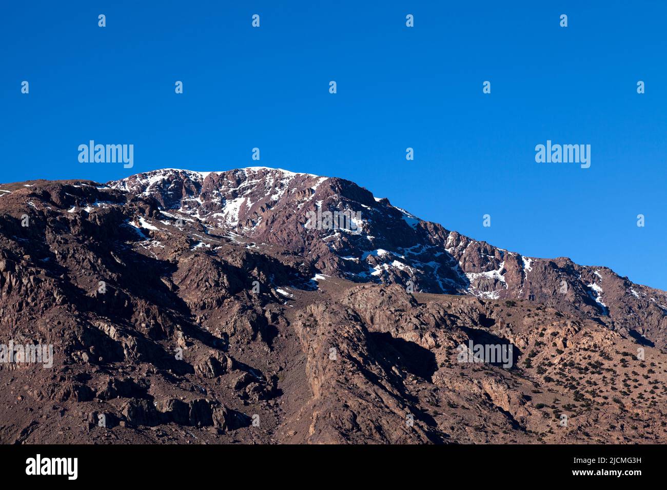 Snow capped mountain of the High Atlas Mountains range near the village ...