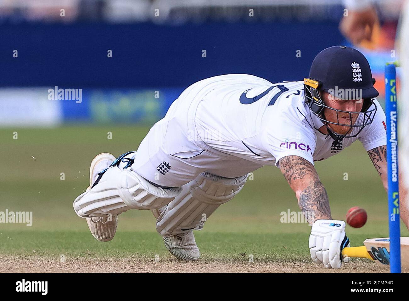 The ball misses the stump as Ben Stokes of England is nearly ran out ...