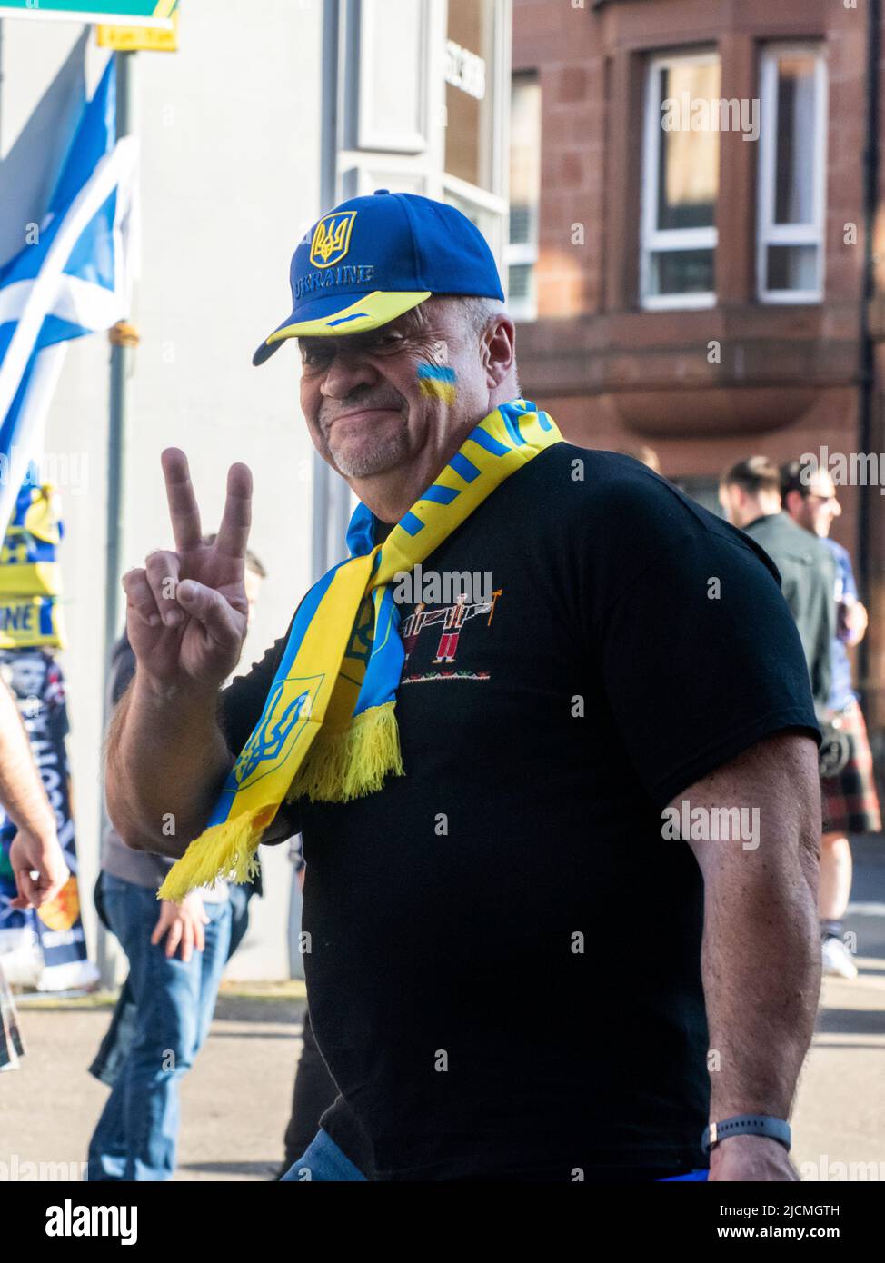 Glasgow, Scotland. UK. June 1st, 2022: An Ukraine fan giving the peace ...