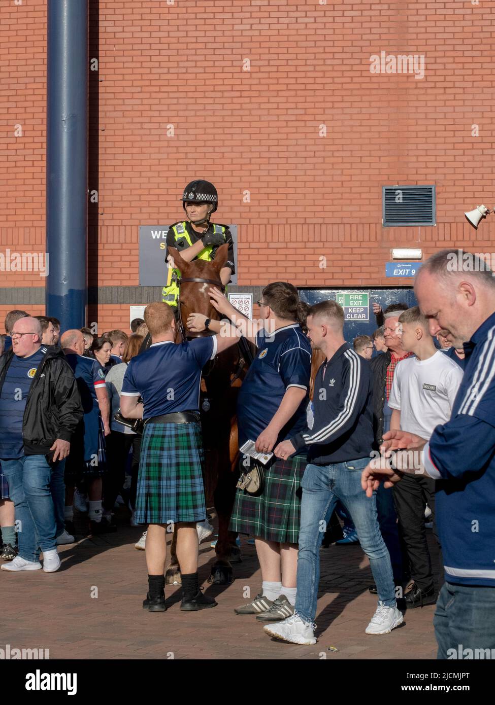 Glasgow, Scotland. UK. June 1st, 2022: Two Scotland fans stroking a ...