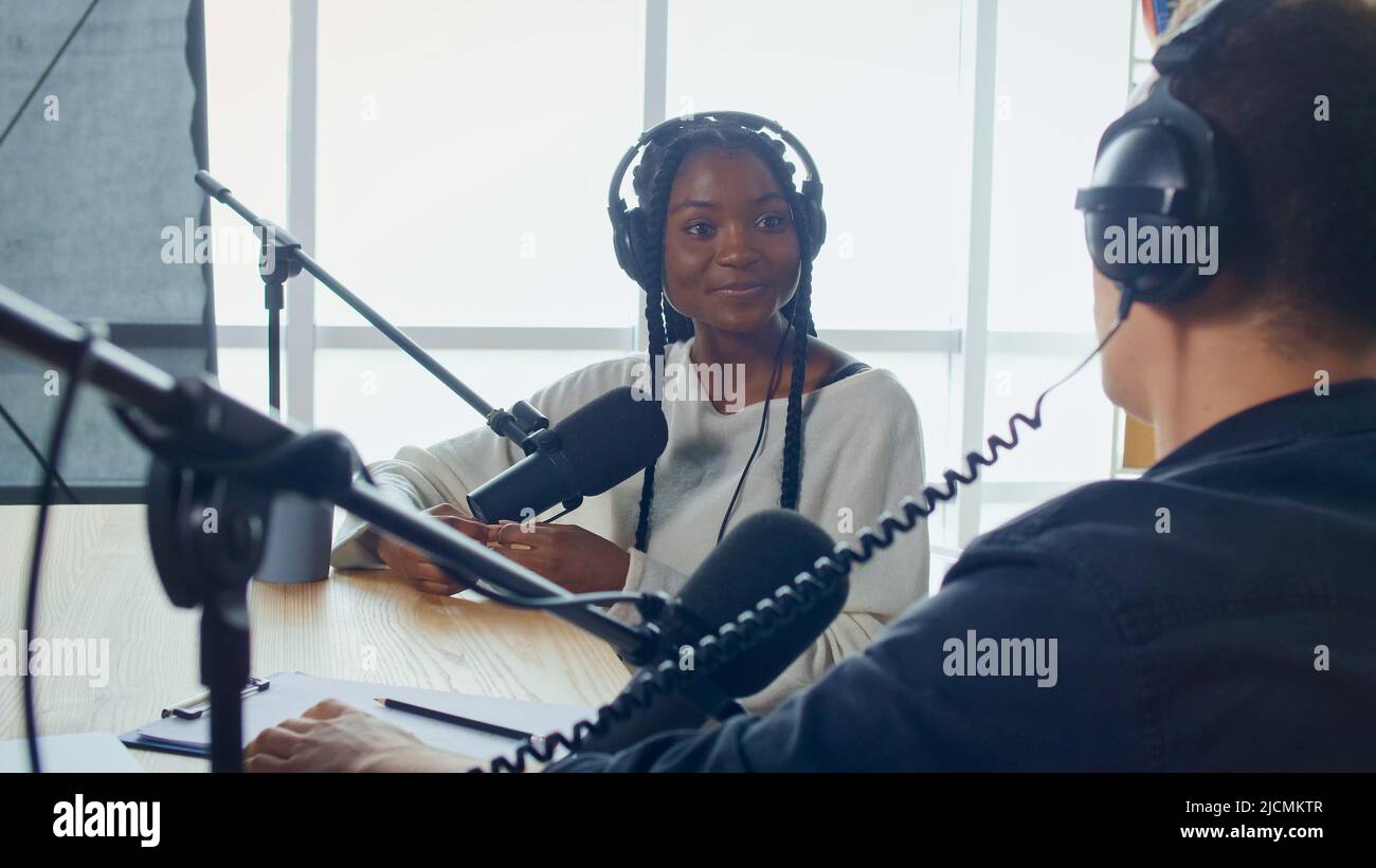 Female Host Talking to a Guest Friend on a Podcast Radio Station in the ...