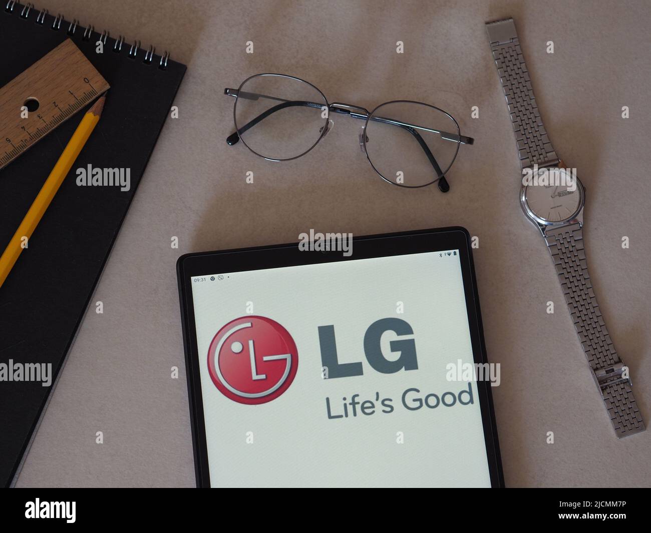 In this photo illustration LG Group logo seen displayed on a tablet ...