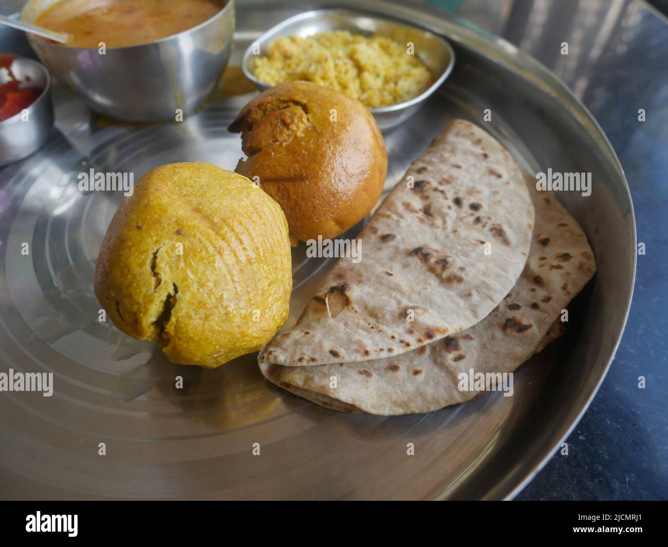 Dal bati rajasthani traditional vegetarian food plat in rural india ...