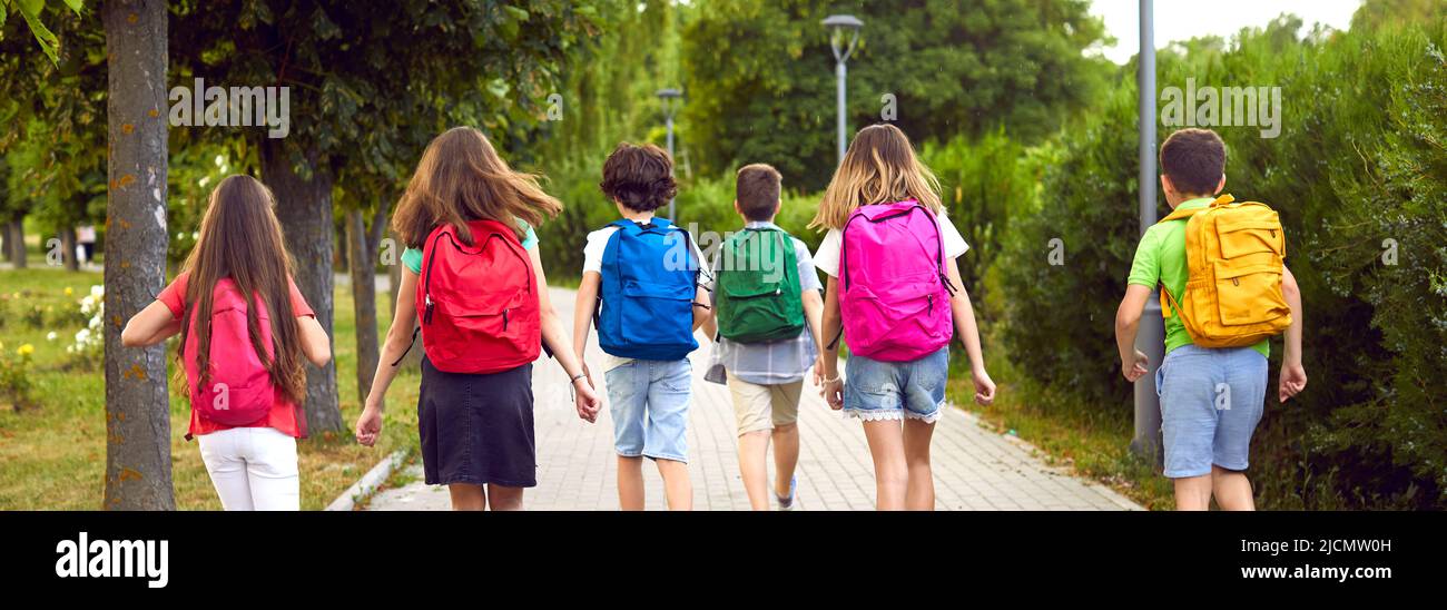 Children with backpacks hi-res stock photography and images - Alamy