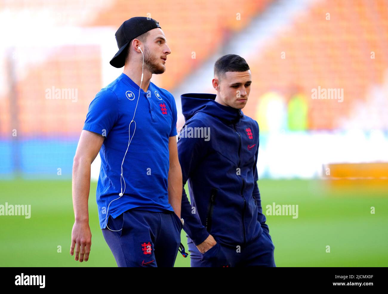 England's Declan Rice (left) and Phil Foden inspect the pitch ahead of ...
