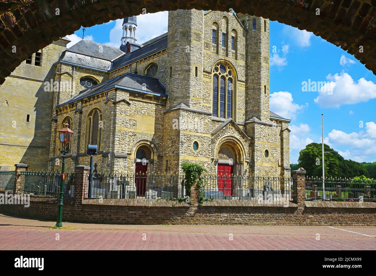 View under stone arch on beautiful medieval church, national dutch ...