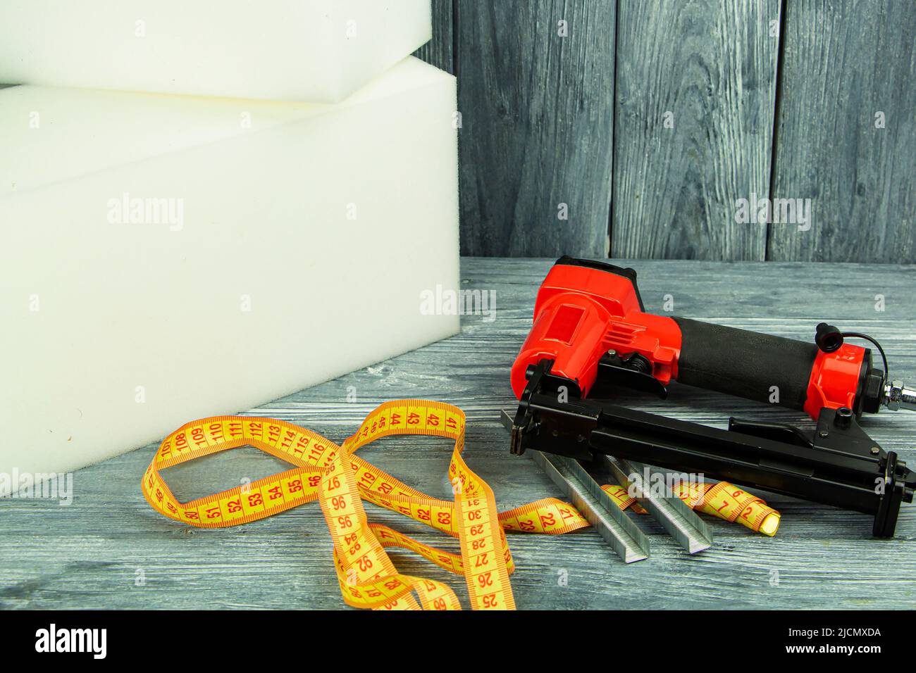 concept of furniture production and repair. Stapler and staples ...