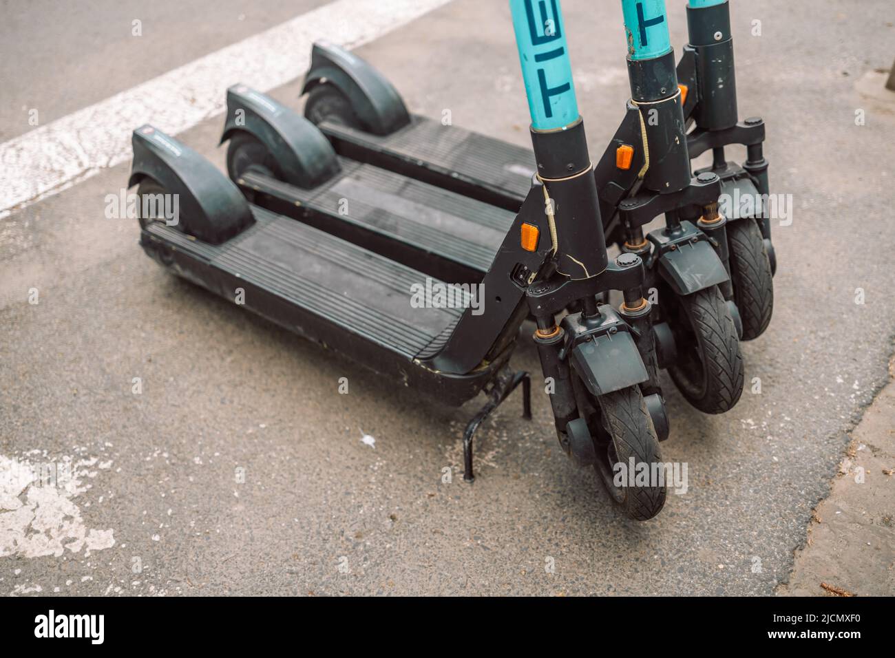 Modern electric scooter parking on the street Stock Photo - Alamy