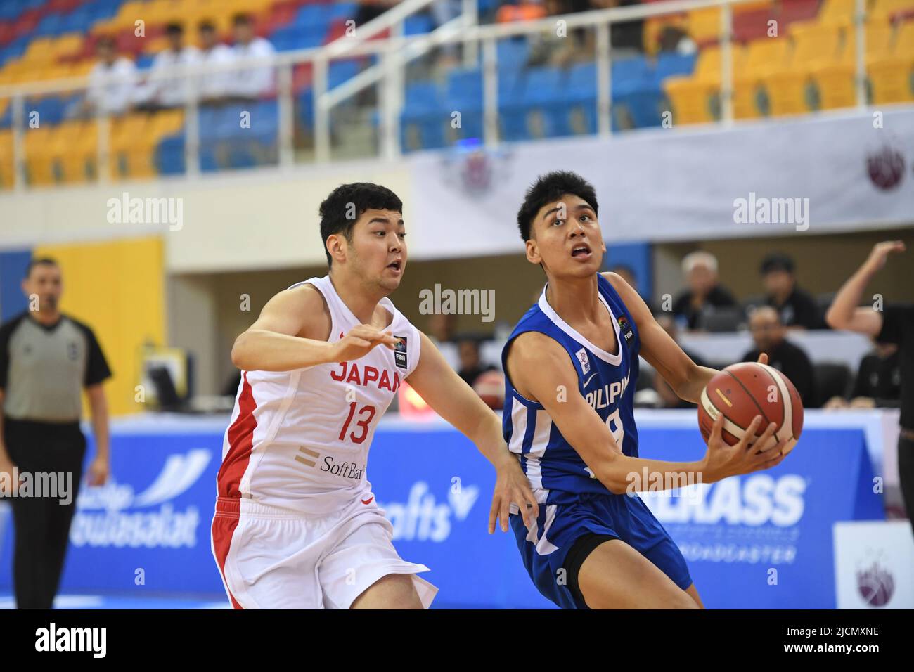 Doha, Qatar. 14th June, 2022. Yeruchika Naito of Japan Basketball team (L) and Jacob Bayla of ...