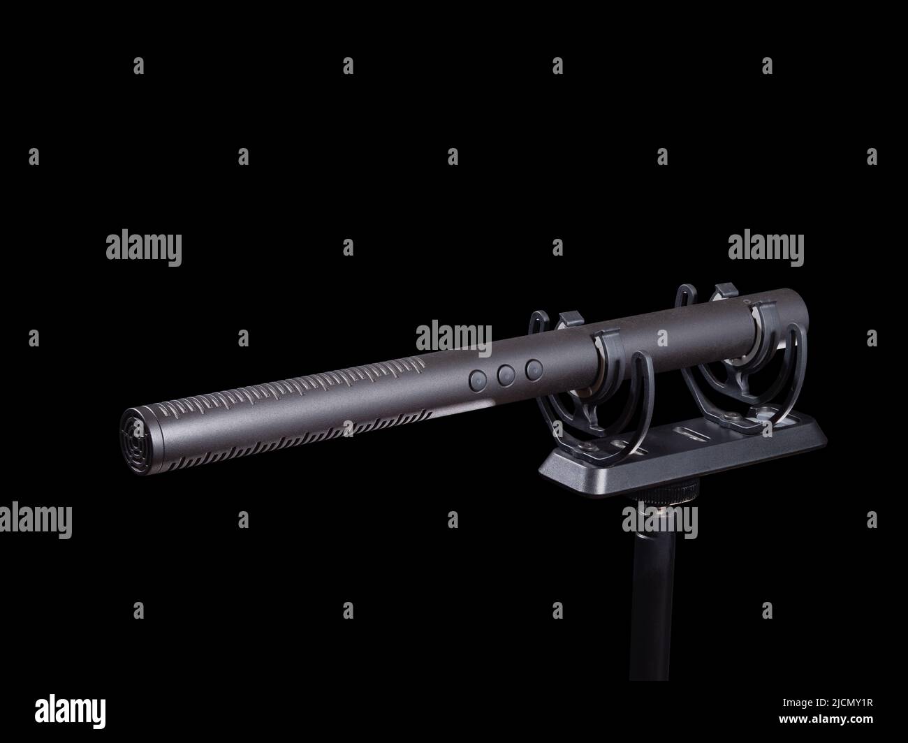 Microphone gun on a shock mount isolated on black background Stock ...