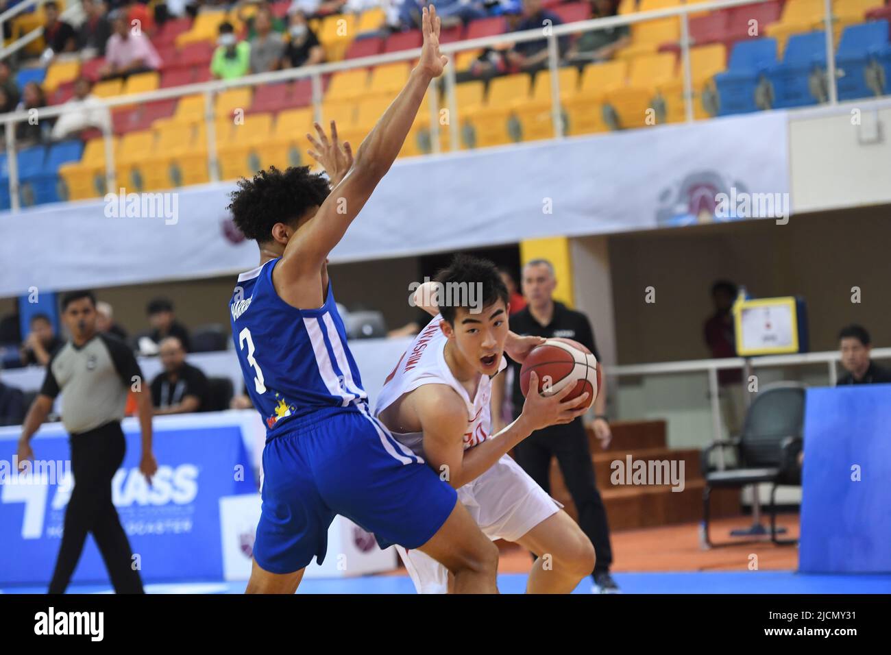 Sebastian Roy Reyes (L) of the Philippine Basketball team and Yuto ...