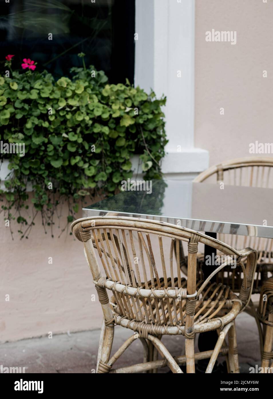 Empty patio seating. Outdoor cafe in the old town Stock Photo - Alamy