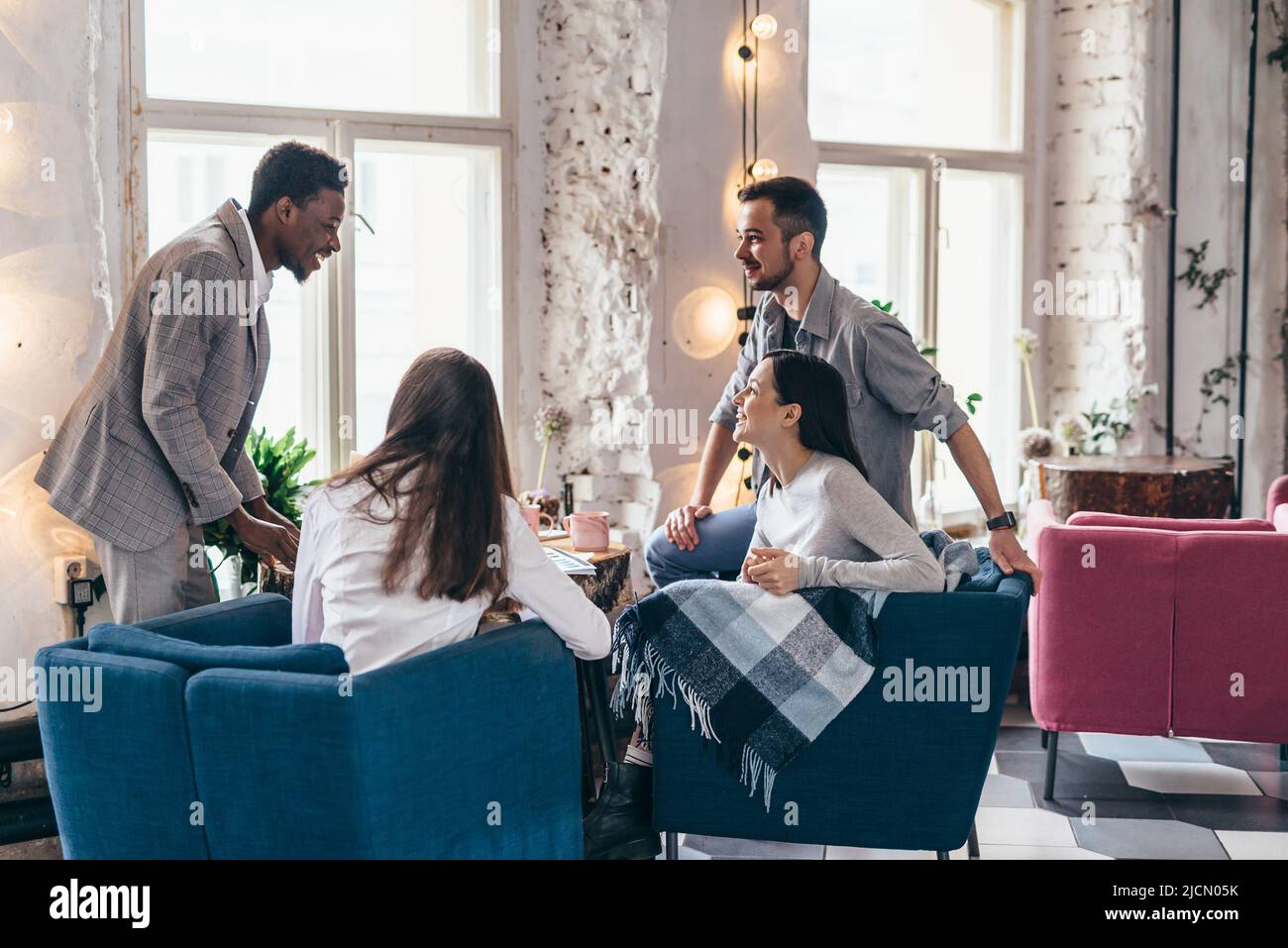 Group of students sitting together and studying Stock Photo - Alamy