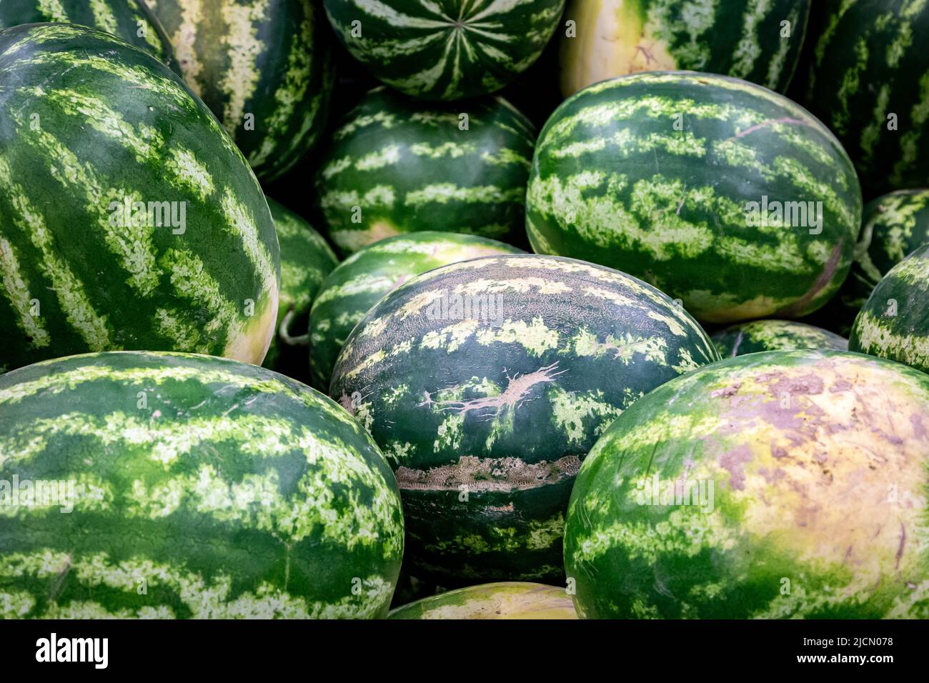 A full frame photograph of whole watermelons for sale on a stall Stock ...
