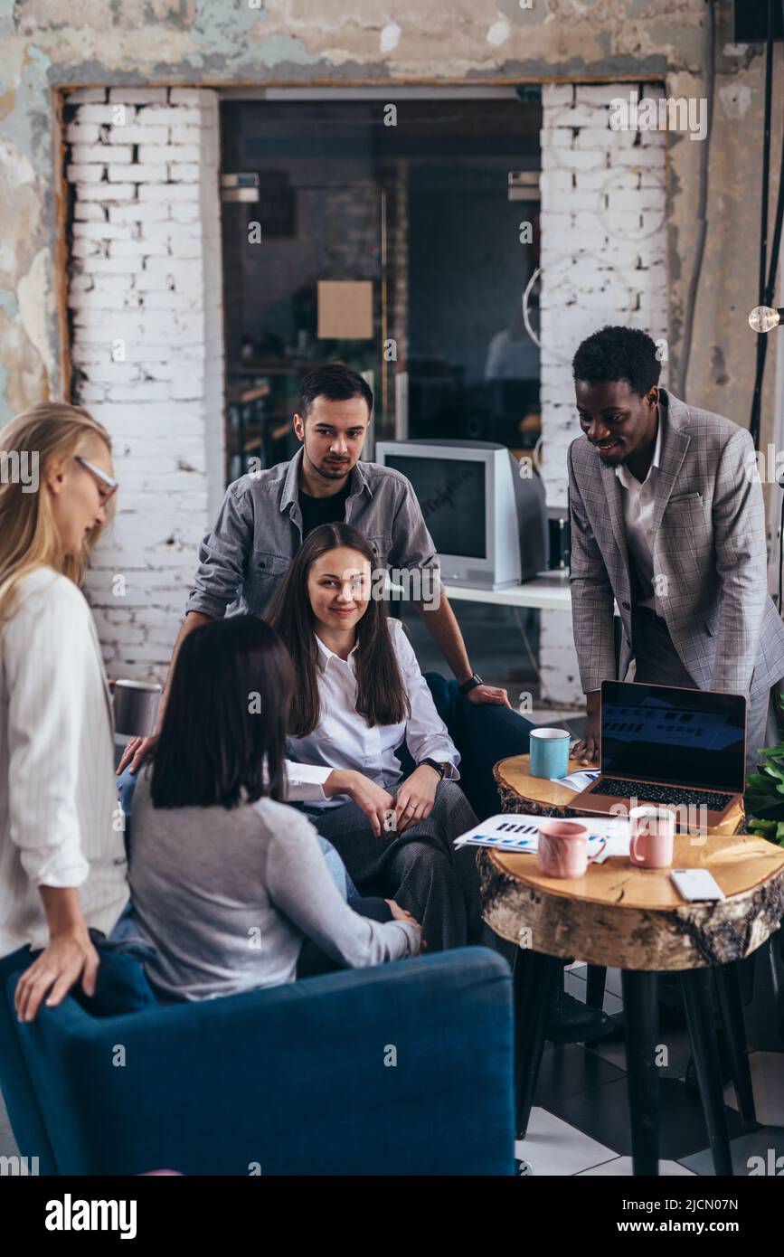 People in office talking during informal meeting Stock Photo - Alamy