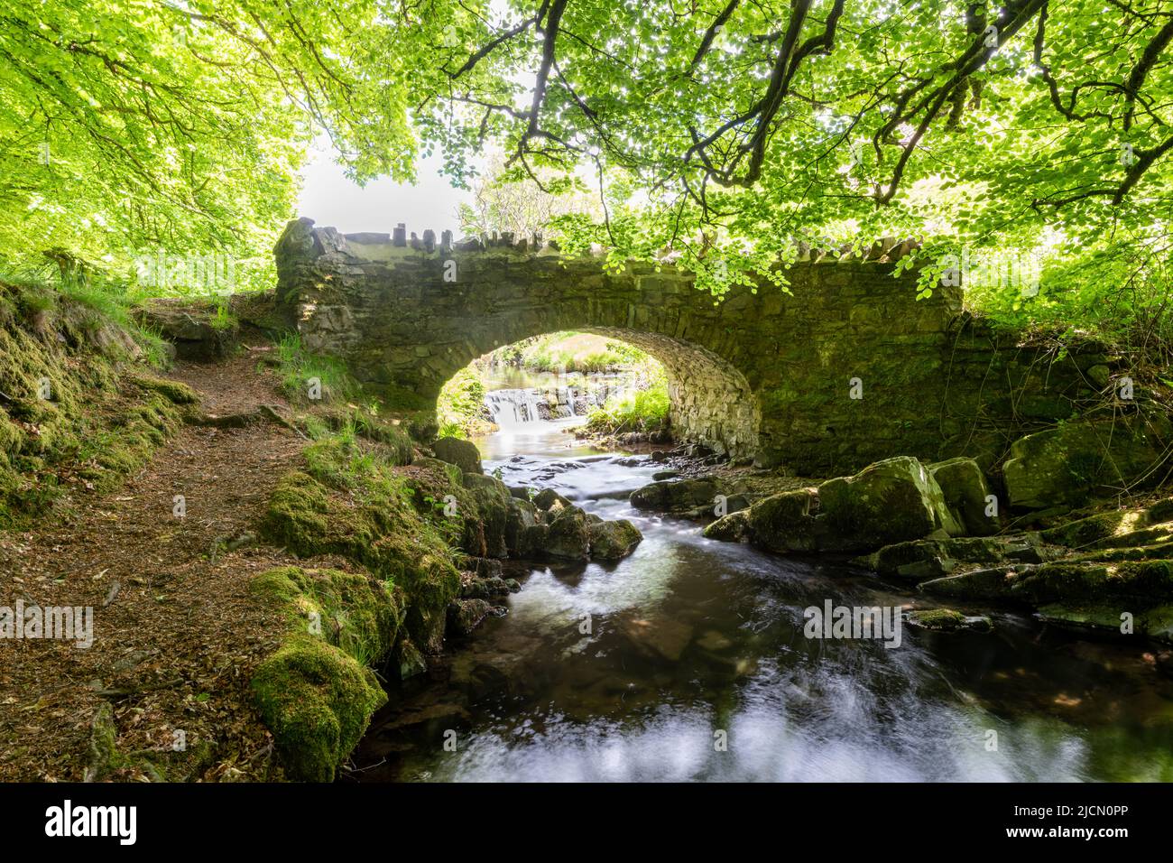 The Weir Water river flowing under Robbers Bridge in Exmoor National ...