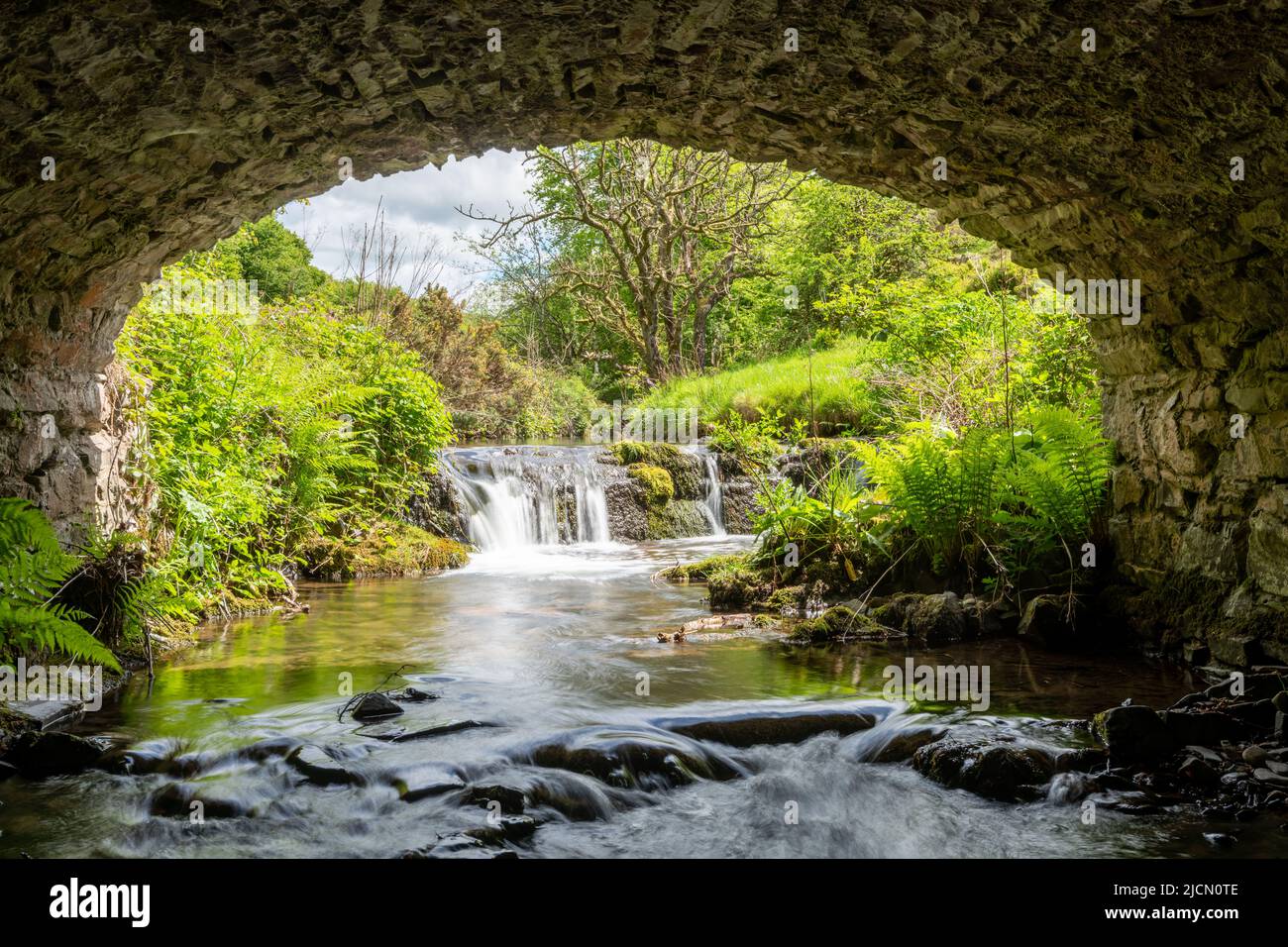The Weir Water river flowing under Robbers Bridge in Exmoor National ...