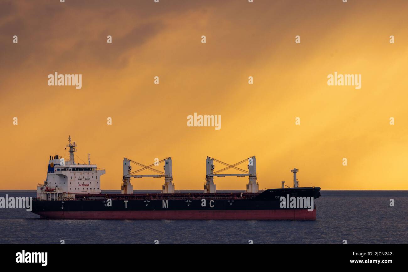 Rostock, Germany. 14th June, 2022. The cargo ship "Dema" lies anchored ...
