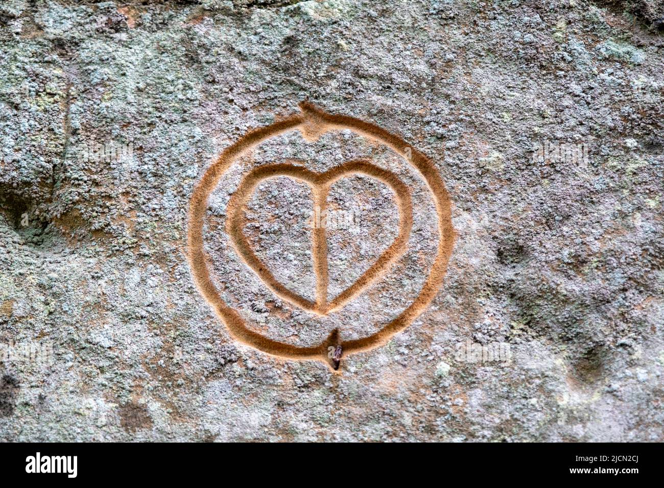 A heart engraved in the rock. Sandstone cliffs is approximately one ...