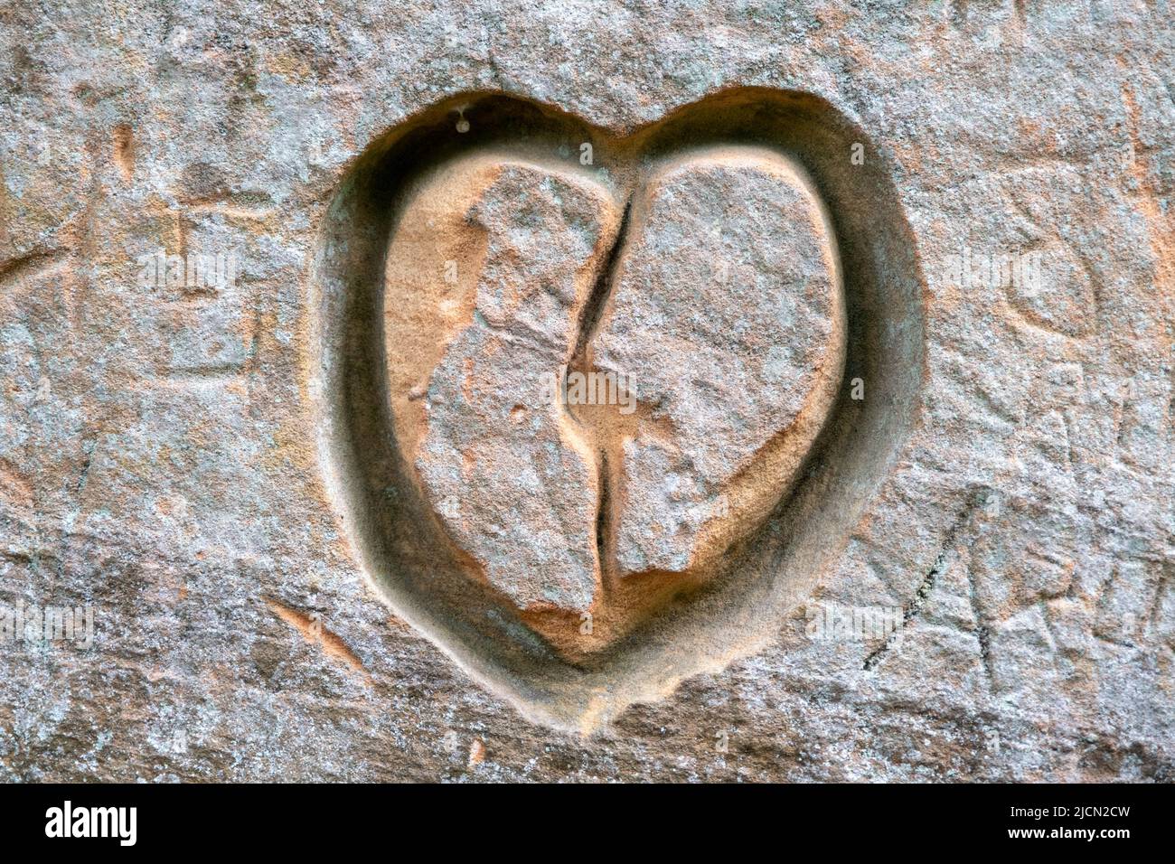 A heart engraved in the rock. Sandstone cliffs is approximately one ...