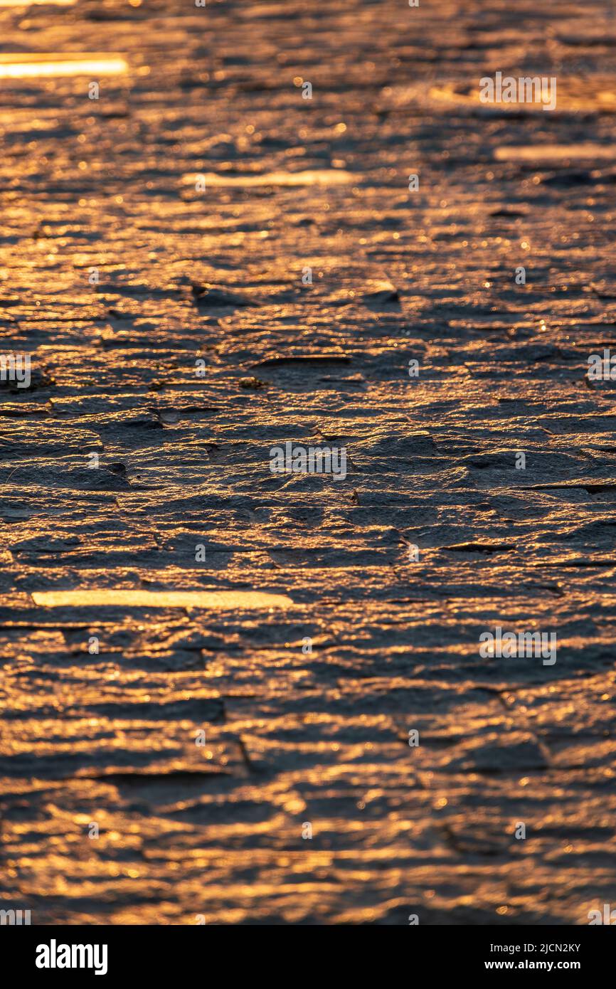 Stone pavement in the rays of the setting sun. Backround of Block ...