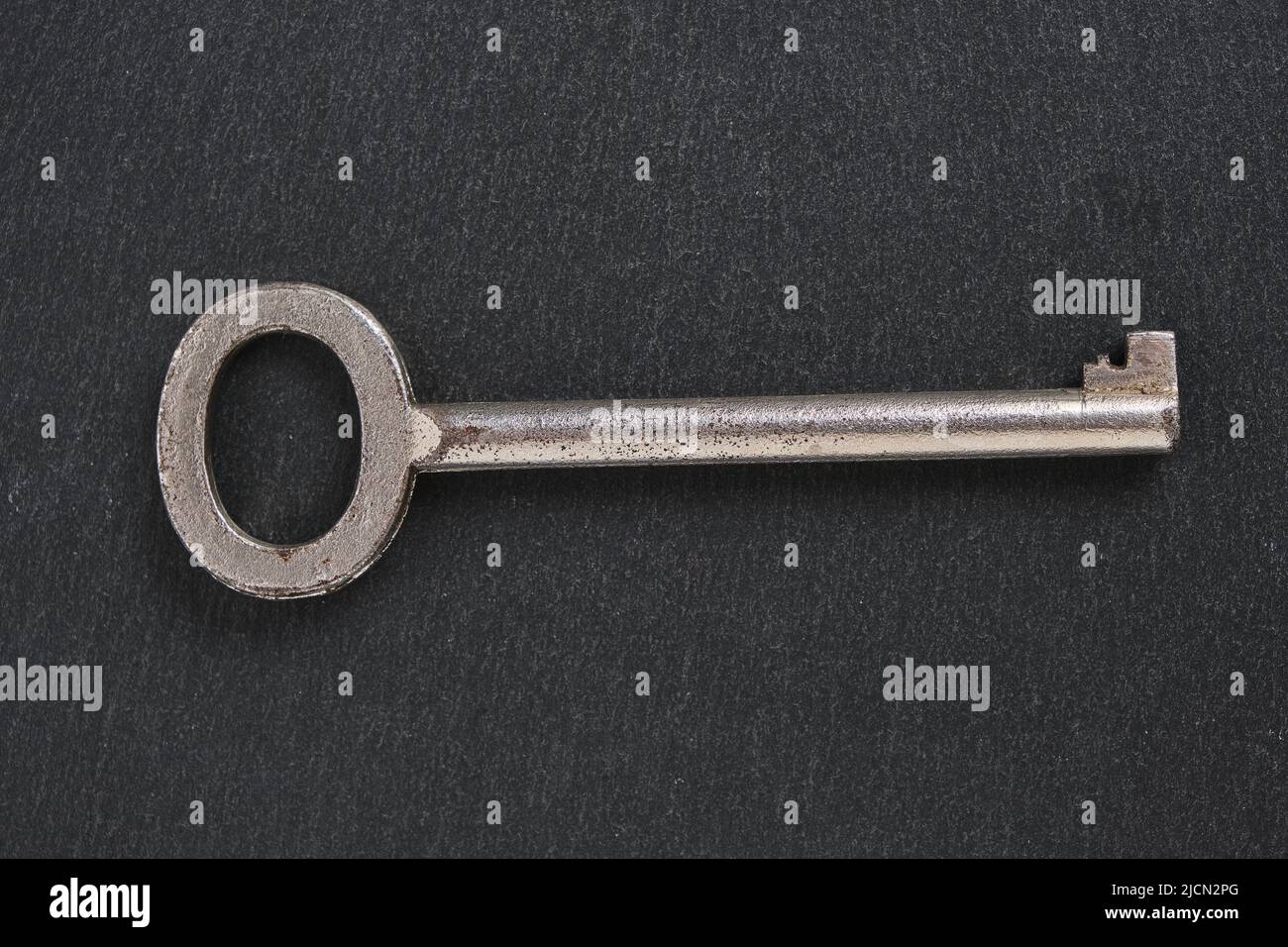 Old, retro vintage key dark background Stock Photo - Alamy