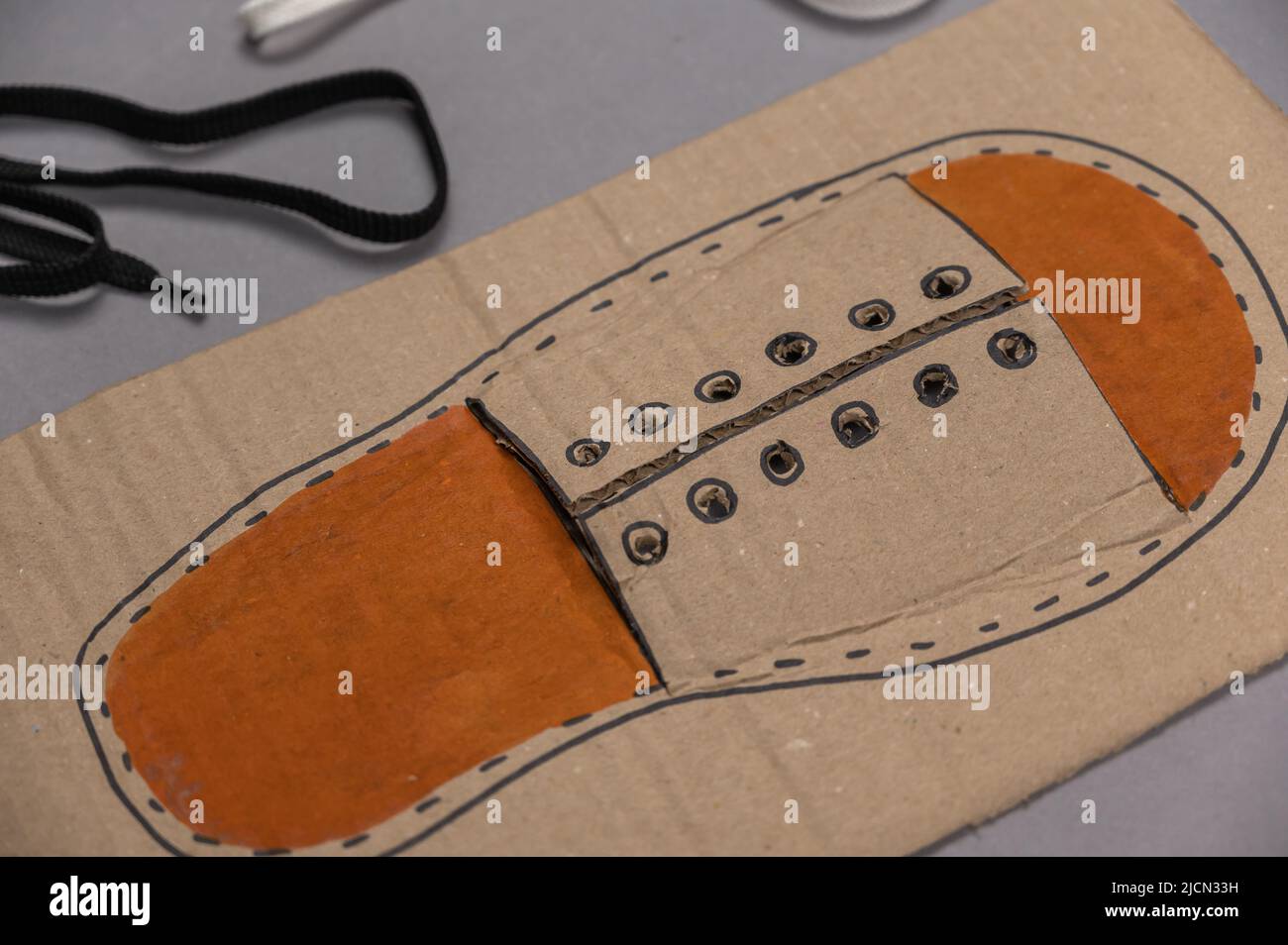 Homemade Lace Tie Card against gray background. The black flat shoelace ...